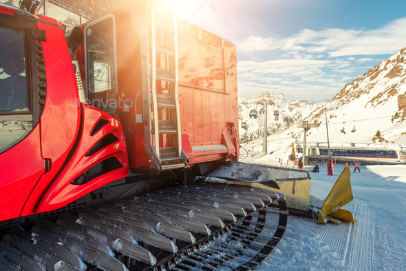Red modern snowcat ratrack with snowplow snow grooming machine ...