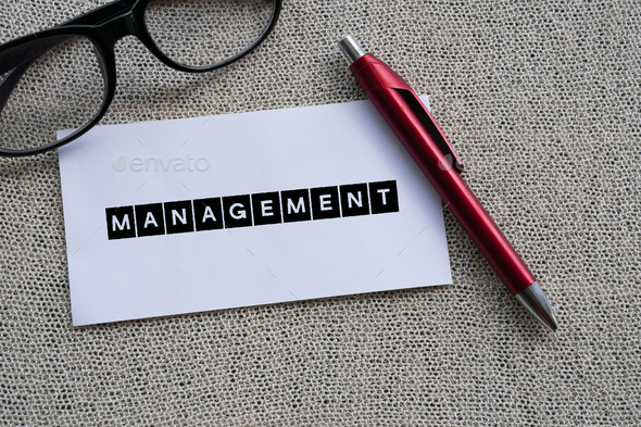 The word MANAGEMENT on white paper with a red pen Stock Photo by ...