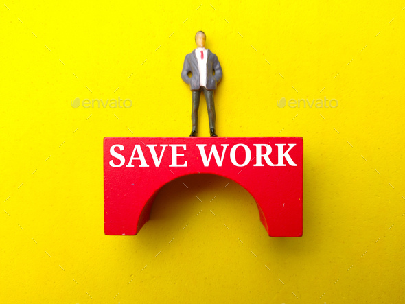 Miniature people and colored block with the word SAVE WORK. Stock Photo ...