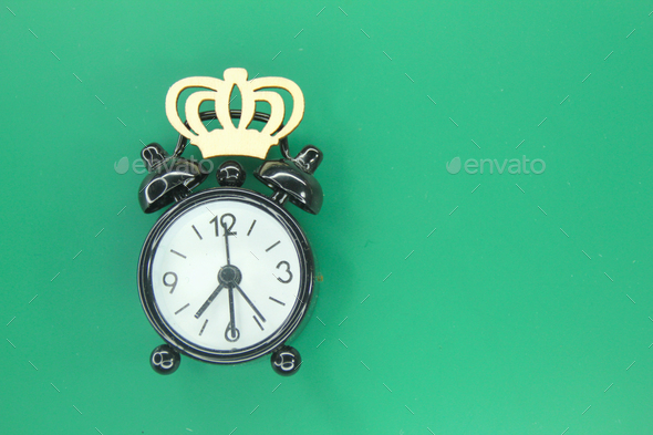 the bell clock is crowned with a crown above. the concept of time is ...