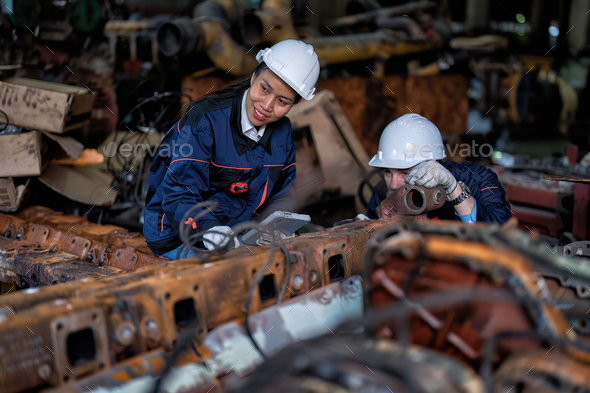 Maintenance manager and engineer checking part large engine ...