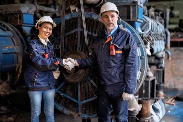 Maintenance manager meet engineer checking part for repair machine and ...