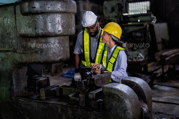 Maintenance manager and engineer checking part large engine ...