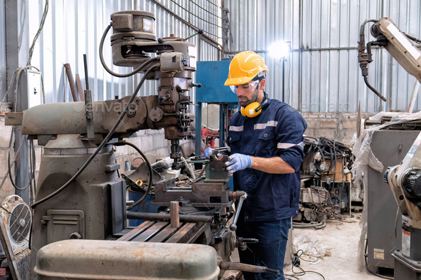 In robotic repair shop engineer use drilling machine fabricate part and ...