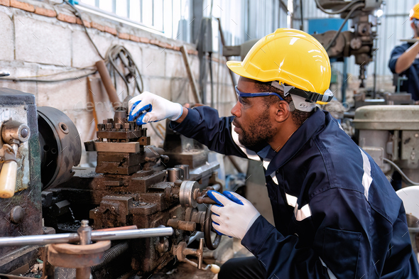 In robotic maintenance repair engineer lathe machine fabricate part and ...