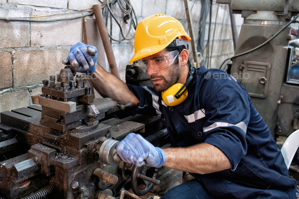 In robotic maintenance repair engineer lathe machine fabricate part and ...