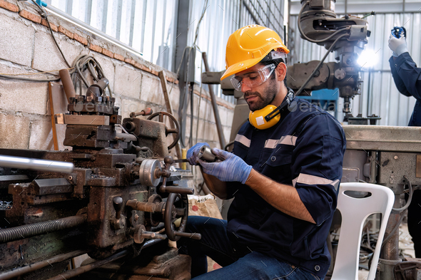 In robotic maintenance repair engineer lathe machine fabricate part and ...