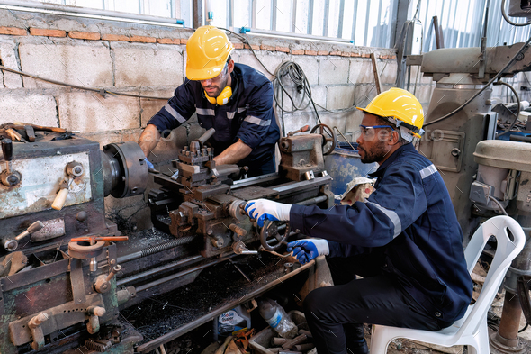 In robotic maintenance repair engineer lathe machine fabricate part and ...