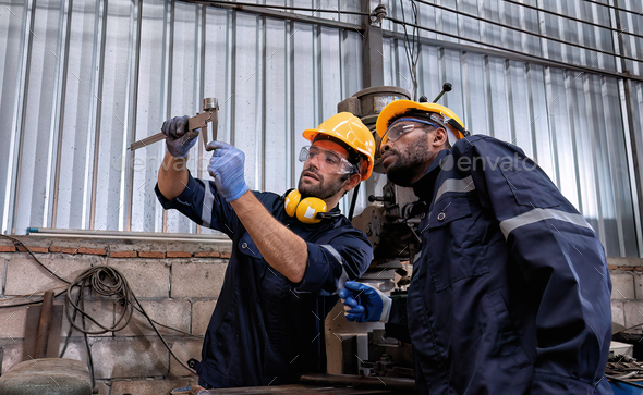 In robotic repair shop engineer use drilling machine fabricate part and ...