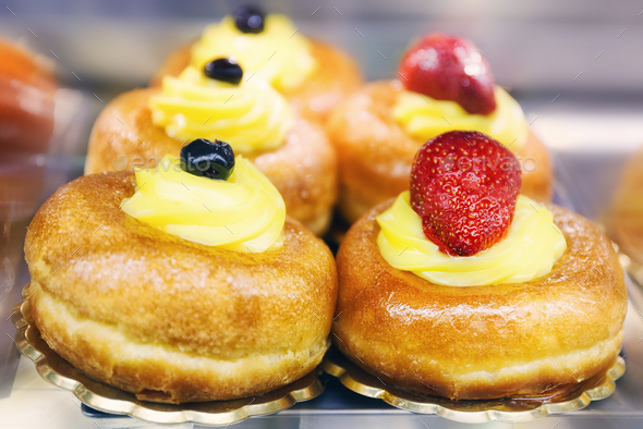 Baba and yellow cream, sweet typical Neapolitan Stock Photo by Graphico_