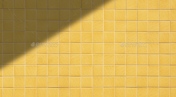 Yellow square tile wall pattern with light and shadow on surface in ...