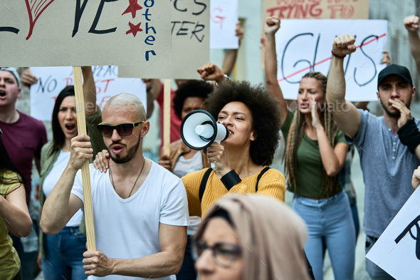 Multi-ethnic group of people protesting against racial discrimination ...