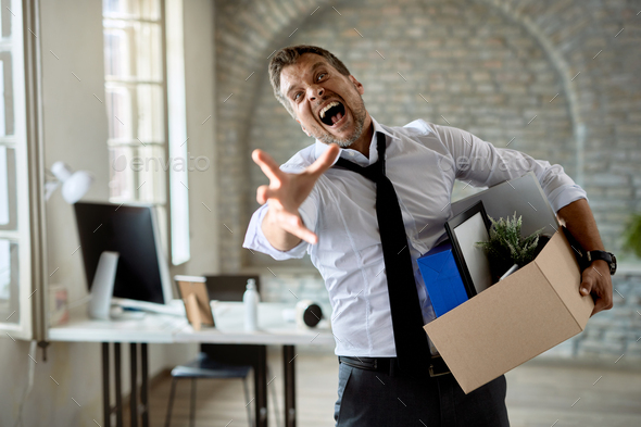 Angry businessman screaming from frustration after being fired from ...