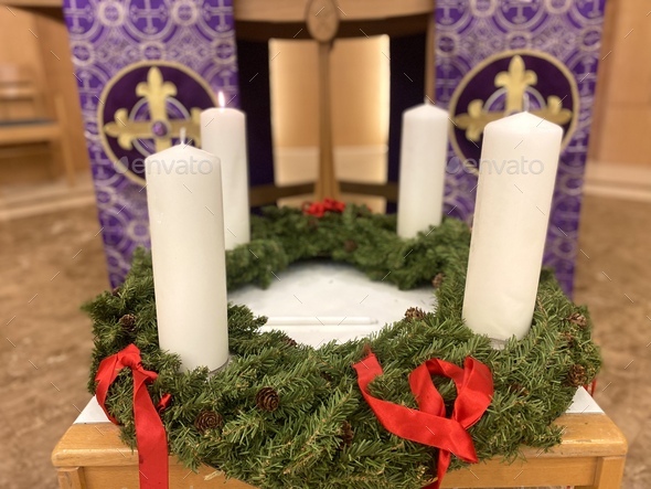 Christmas Advent wreath in a church setting with candle of Hope lighted ...