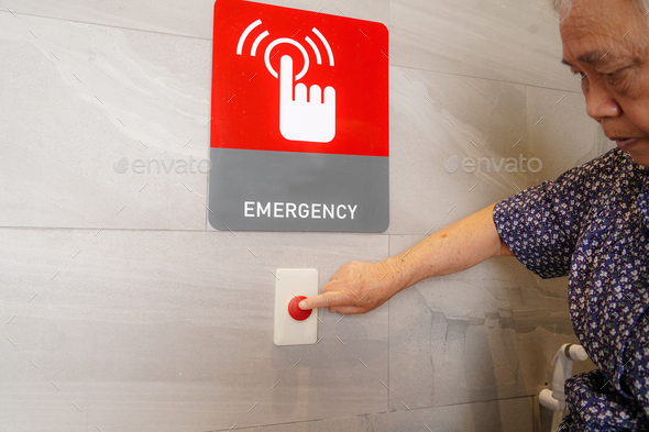 Asian senior woman patient press emergency button in a special toilet ...
