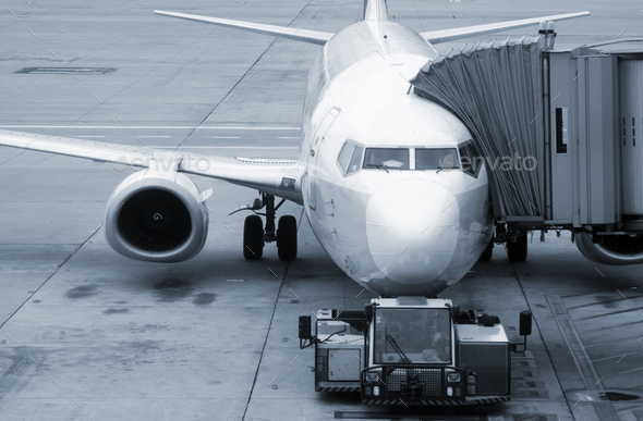 Aircraft standing at the airport ready for boarding Stock Photo by Cebas