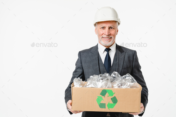 Caucasian middle-aged mature architect holding carton box full of ...