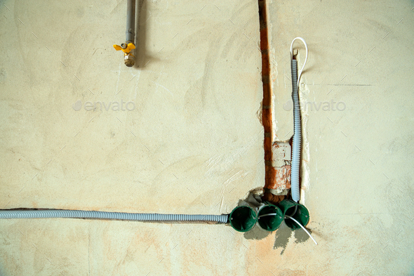 New electrical wiring installation, plastic boxes and electrical cables ...