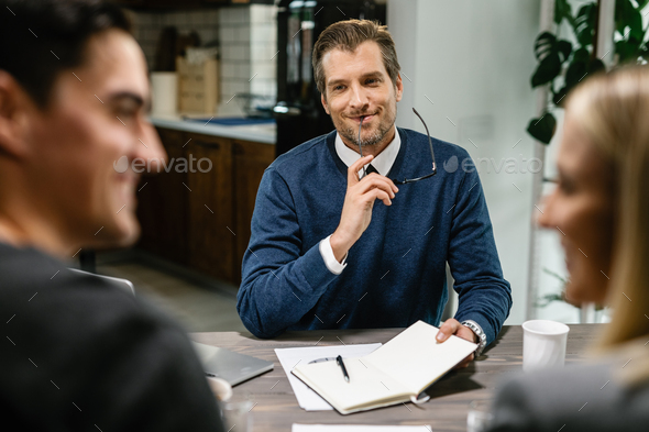 His greatest satisfaction are his happy clients! Stock Photo by drazenphoto