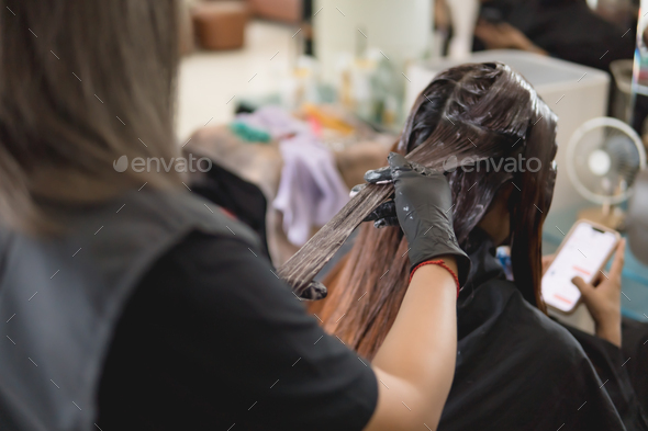 Hair coloring in a beauty salon, Asian women hair coloring in beauty ...