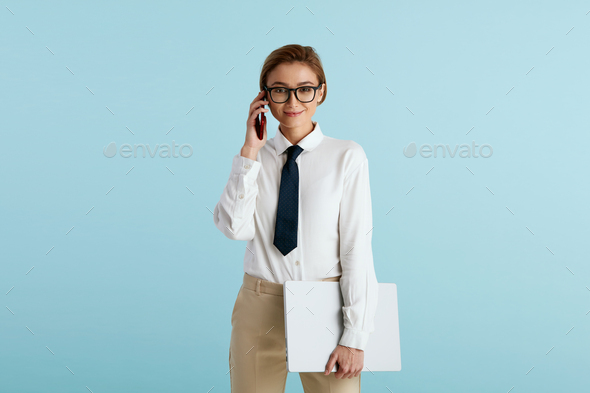 Smiling Businesswoman Talking Smartphone. Woman Smiling, Holding Laptop ...