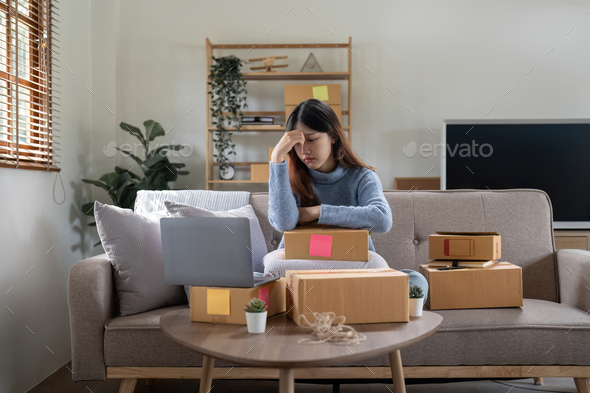 Asian woman feel worry stress and headache during waiting new order ...