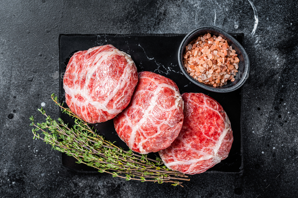 Raw Atriaux cutlets, ground pork wrapped in caul fat, swiss sausage ...