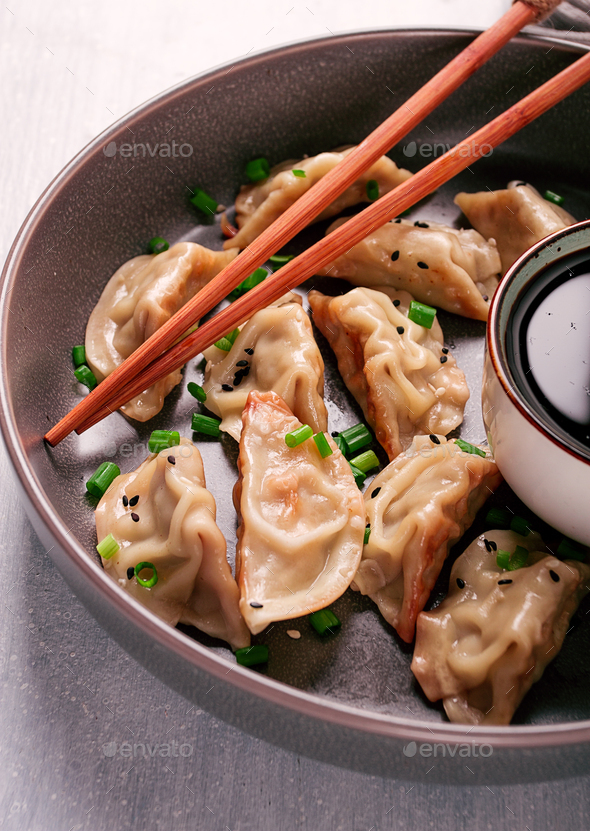 Japanese Gyoza dumplings,fried, with sauce, top view, without people ...