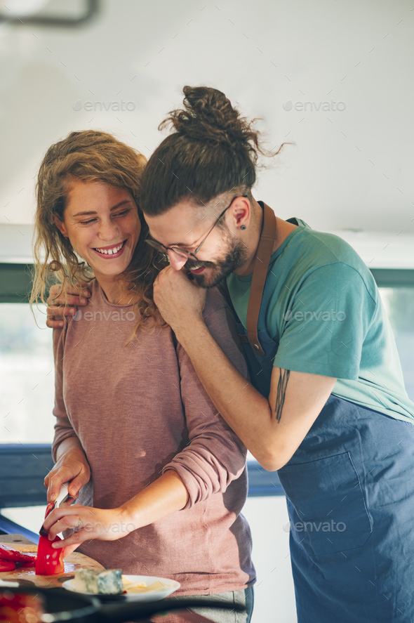 Young couple making breakfast together in the kitchen at home Stock ...