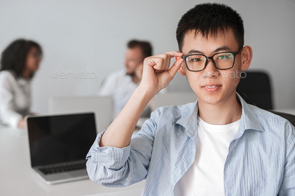Smiling boy with laptop in office Stock Photo by kegfire | PhotoDune