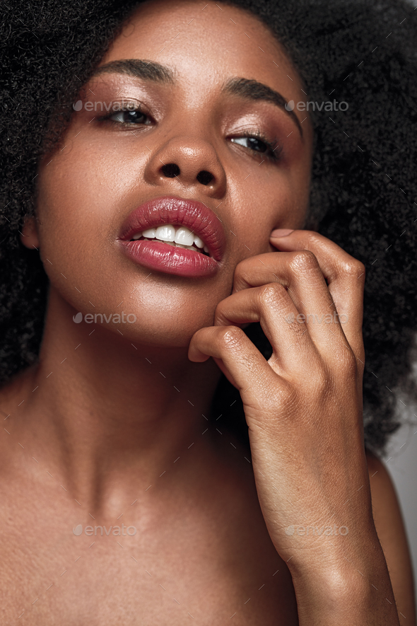 Displeased black woman scratching face Stock Photo by kegfire | PhotoDune