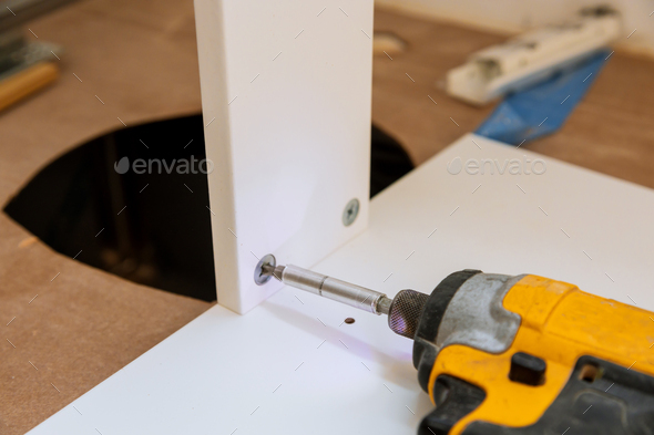 Wooden furniture installing cabinet shelf screws screwdriver handle ...