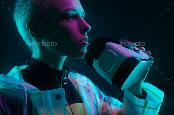 Young woman taking off VR headset Stock Photo by kegfire | PhotoDune