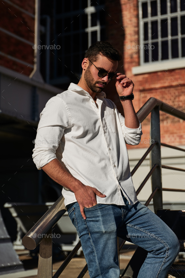 Confident man leaning on railing Stock Photo by kegfire | PhotoDune