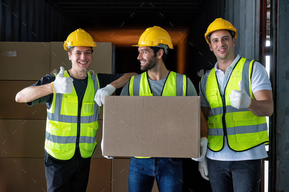 3 Workers carry carton box take from 40 feet steel container on the ...