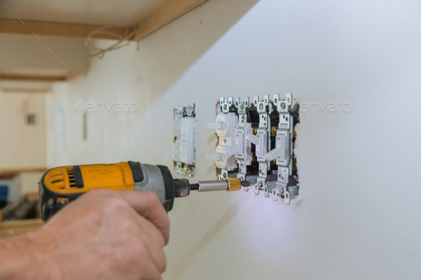 Work on installing electrical outlets. Stock Photo by photovs | PhotoDune