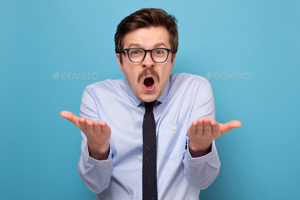 Portrait of a angry young man pointing finger at you camera gesture ...
