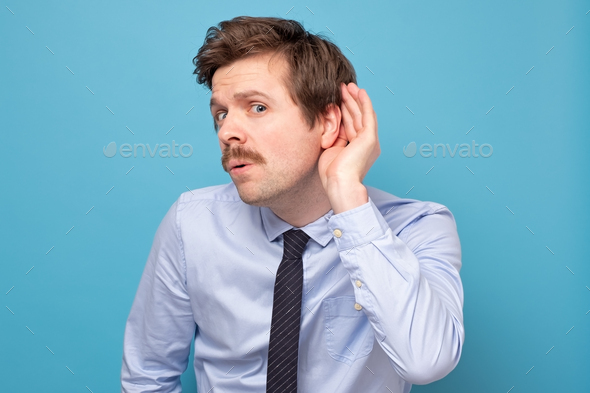 Handsome guy trying secretly listen on a conversation, privacy ...