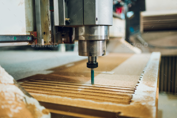 Close shot of a drilling cnc machine at wood machining industry Stock ...