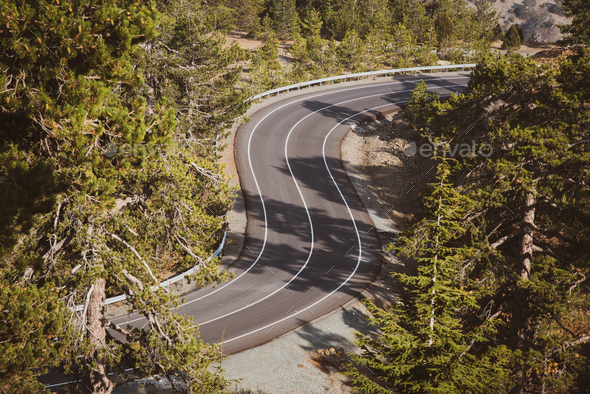 Mountain curved road. Adventure and challenging road trip in the forest ...