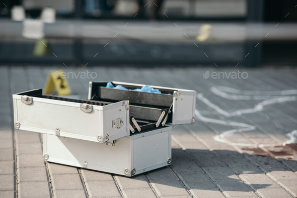 investigation tool box standing open near chalk line Stock Photo by ...