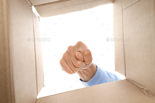 Box with hand showing fig gesture, isolated on white background Stock ...