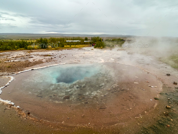 Geothermal area in Iceland. Strokkur geyser in Golden Circle, fumaroles ...