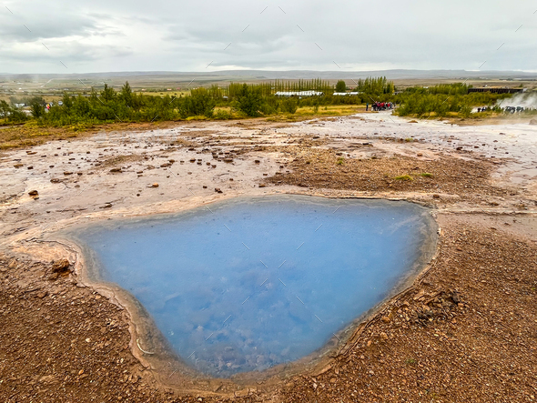Geothermal area in Iceland. Strokkur geyser in Golden Circle, fumaroles ...