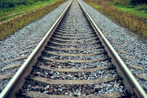 Railway track line going into distance, railroad train track with ...