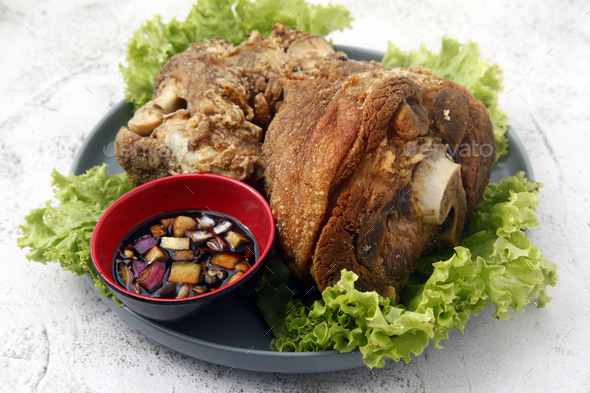 Freshly cooked Filipino food called Crispy Pata Stock Photo by junpinzon