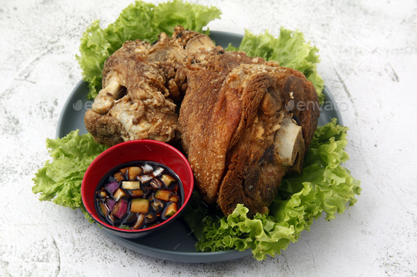 Freshly cooked Filipino food called Crispy Pata Stock Photo by junpinzon