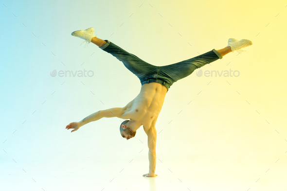 Shirtless male acrobat doing handstand Stock Photo by Photology75 ...