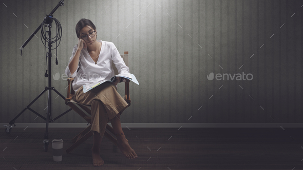 Focused actress reading a script Stock Photo by stokkete | PhotoDune
