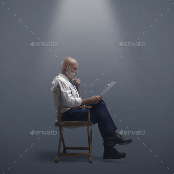 Professional actor reading a screenplay Stock Photo by stokkete | PhotoDune